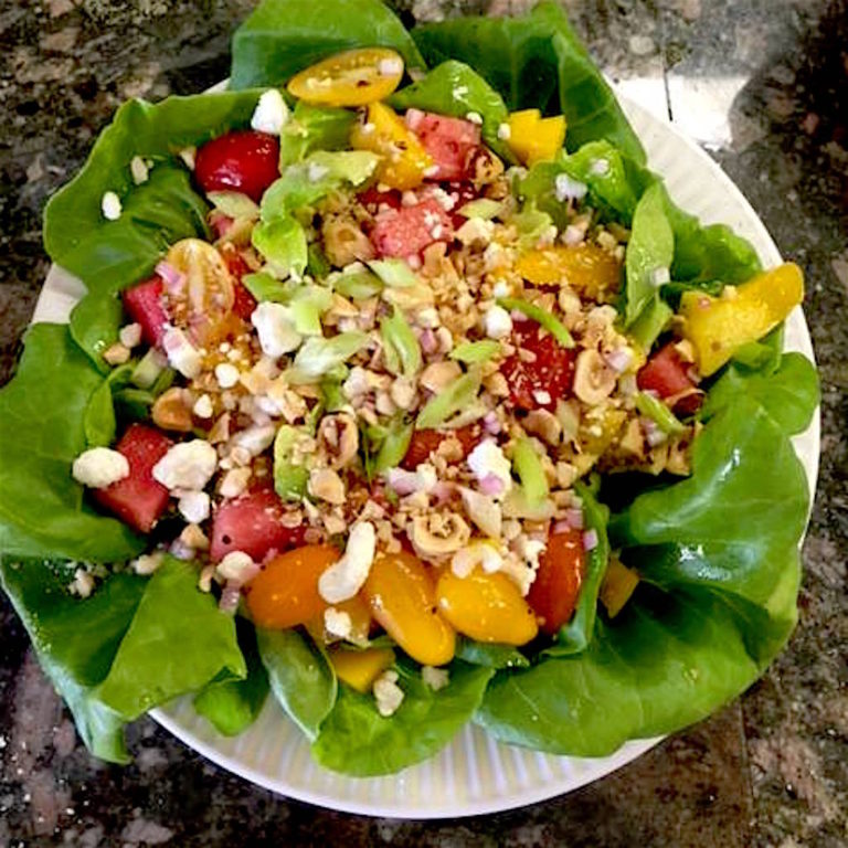 a “lettuce” bowl with watermelon and chopped up stuff – the single plate
